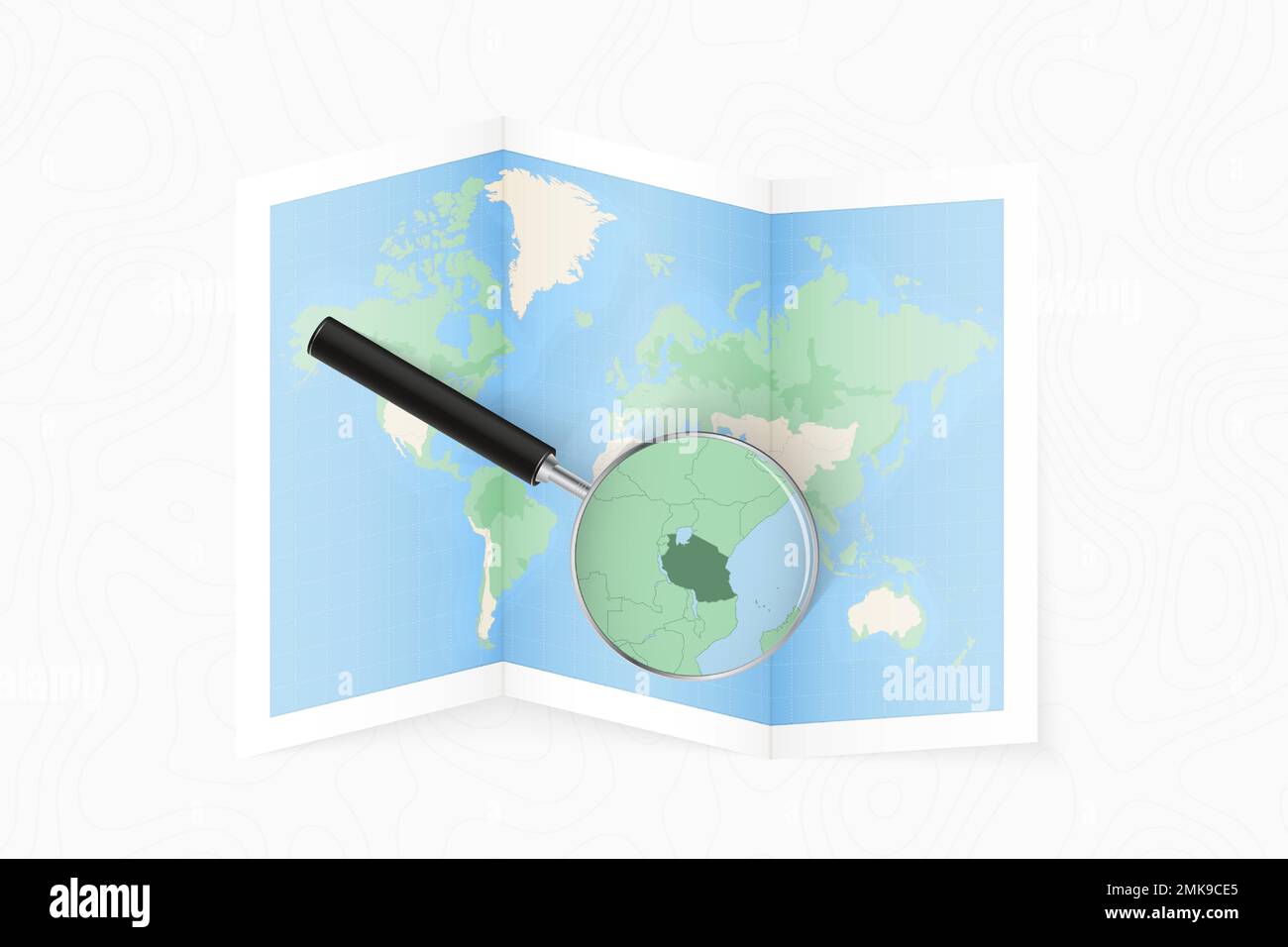 Enlarge Tanzania with a magnifying glass on a folded map of the world ...