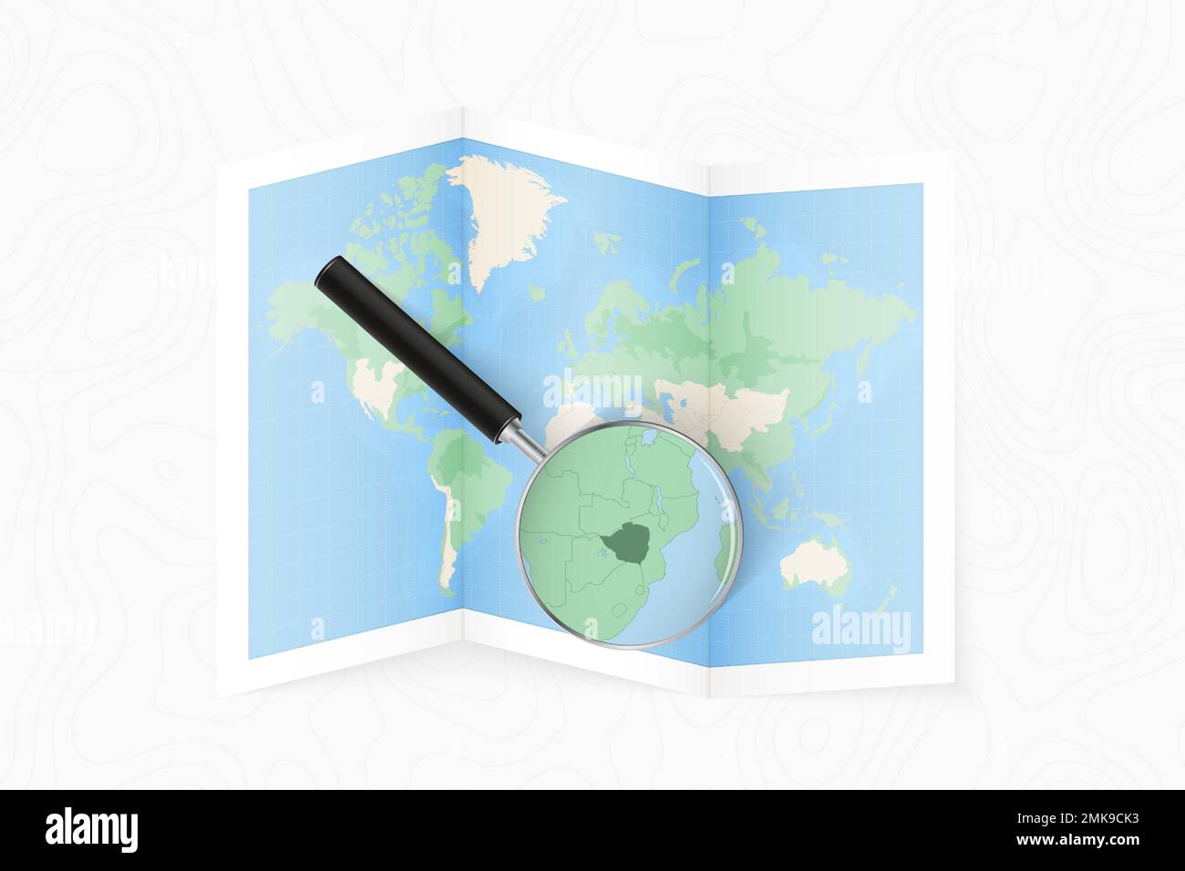Enlarge Zimbabwe with a magnifying glass on a folded map of the world ...