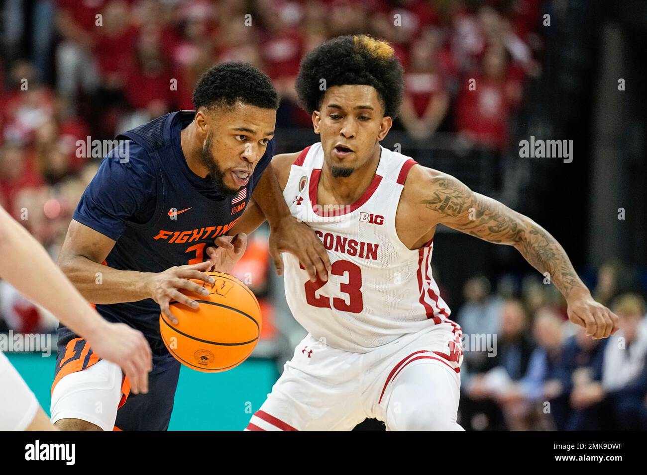 Illinois's Jayden Epps drives against Wisconsin's Chucky Hepburn (23 ...
