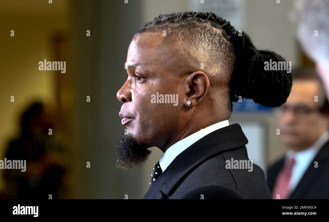 Darryll Johnson, publicist for singer R. Kelly, speaks to the media ...