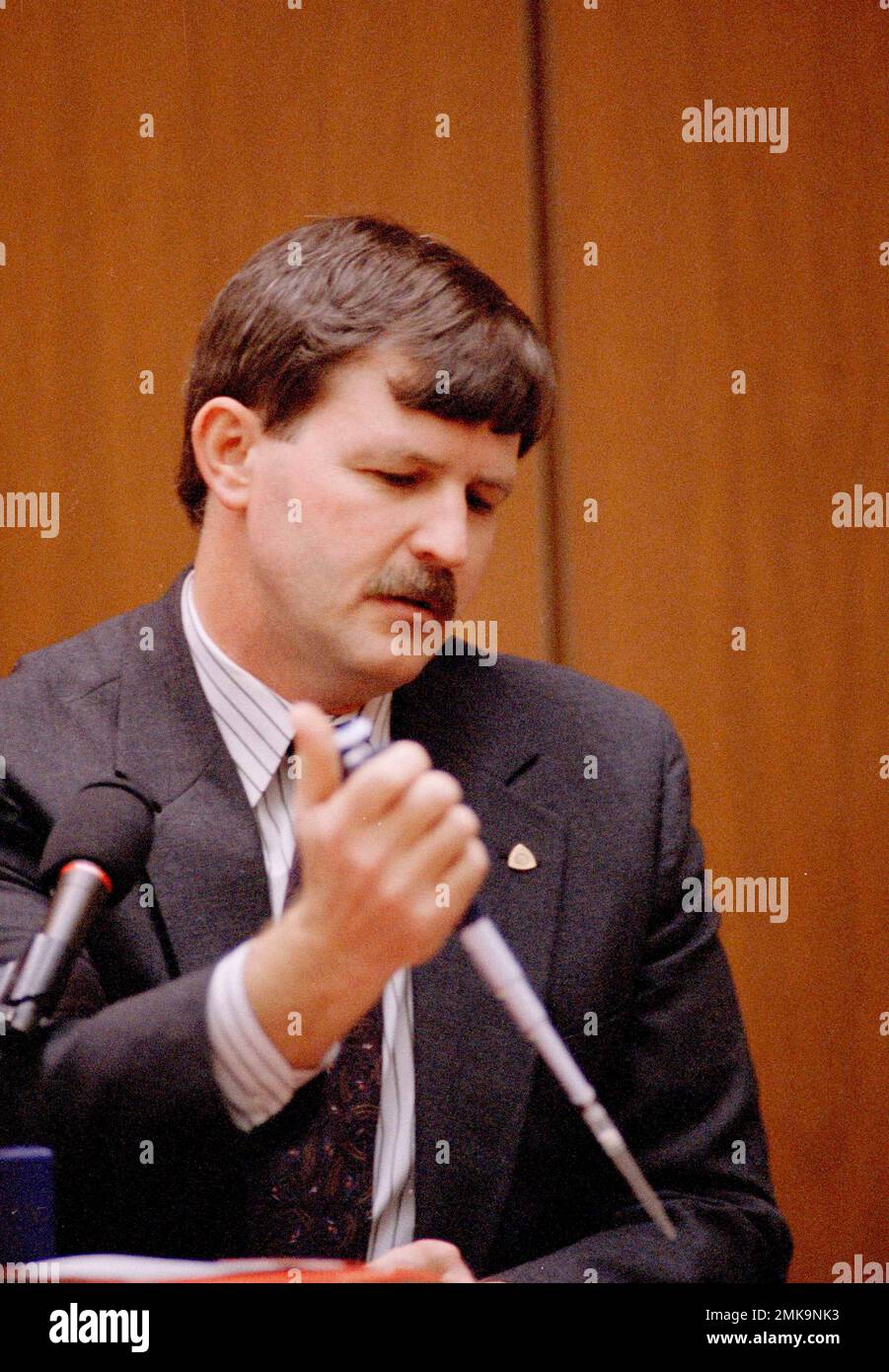 Los Angeles Police Department chemist Gregory Matheson displays a blood ...