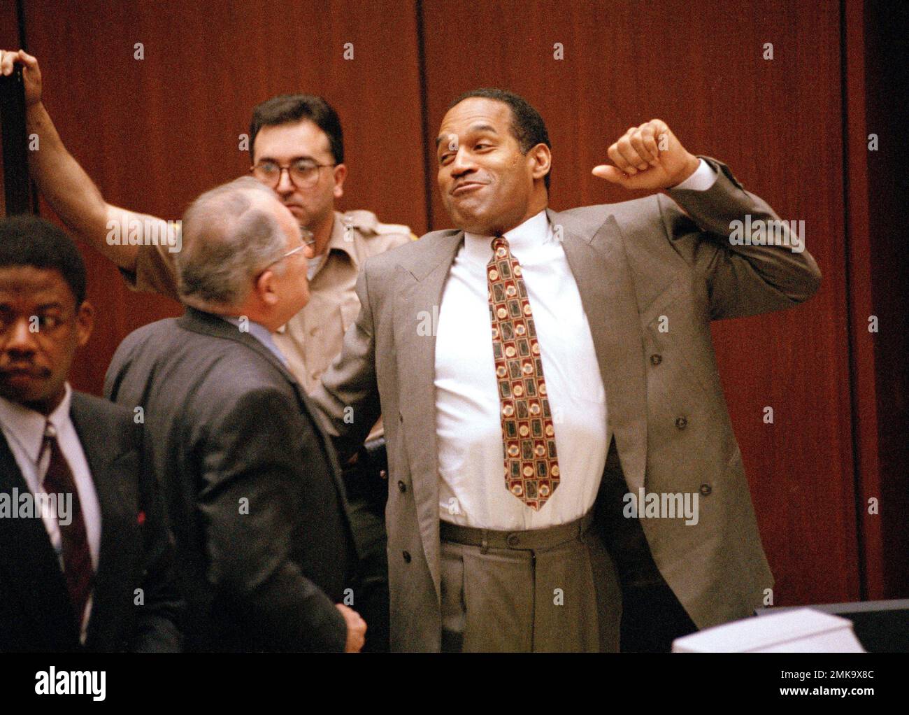 O.J. Simpson stretches while talking to defense attorney F. Lee Bailey ...