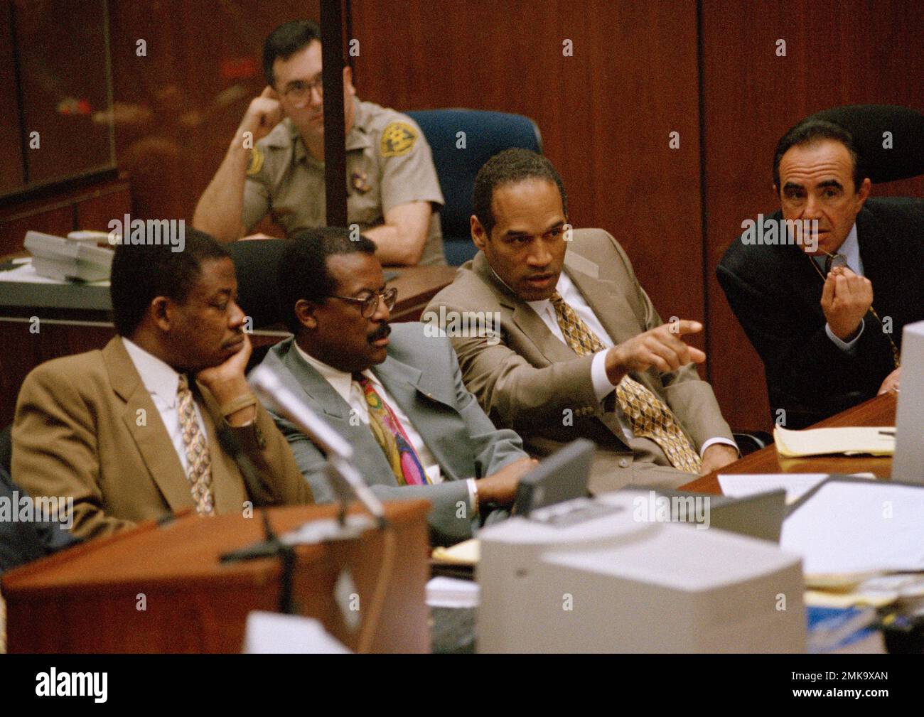 O.J. Simpson points to a video monitor during testimony by Los Angeles ...
