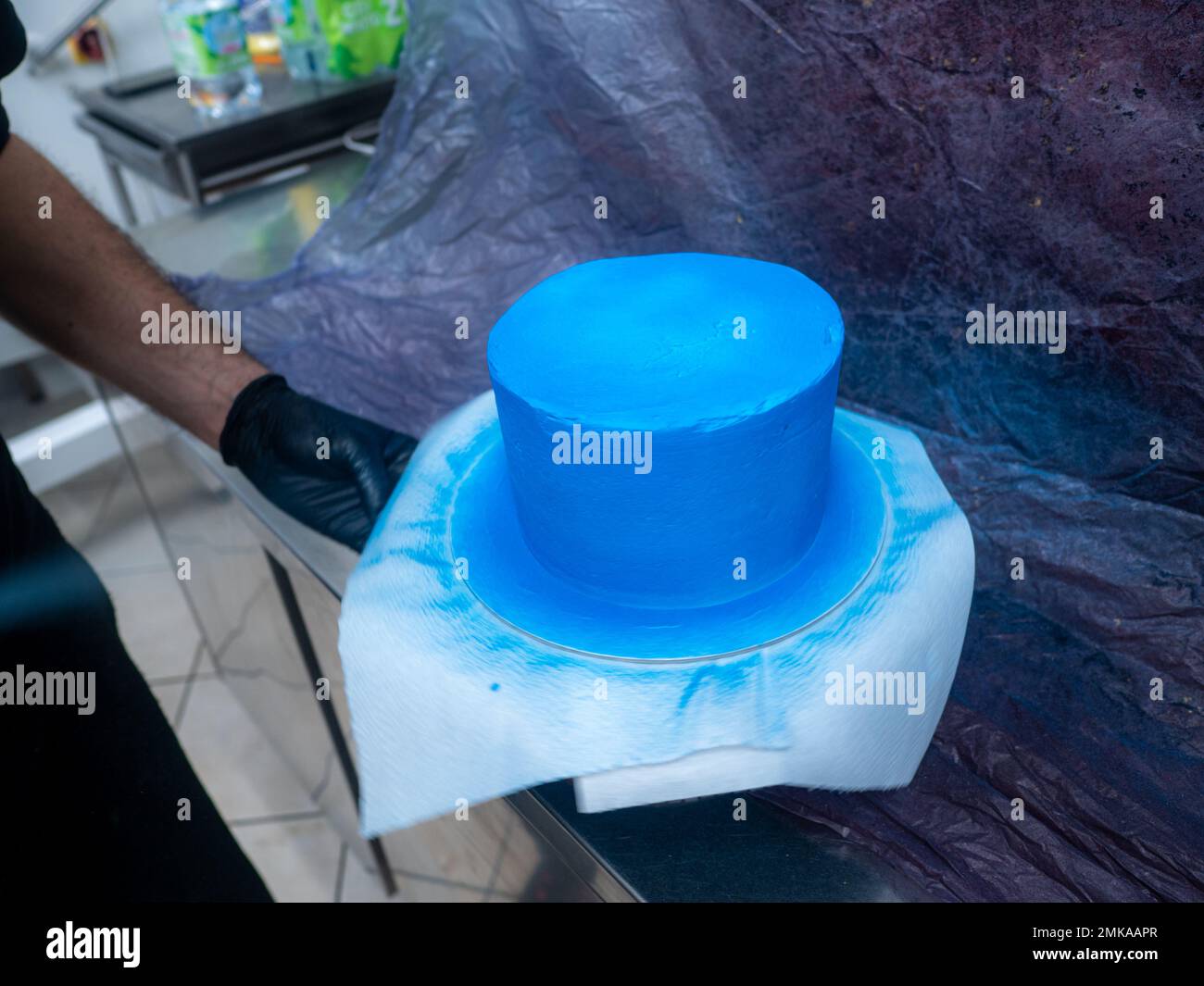 pink icing piping filling for frosted cake decoration in kitchen lab ...