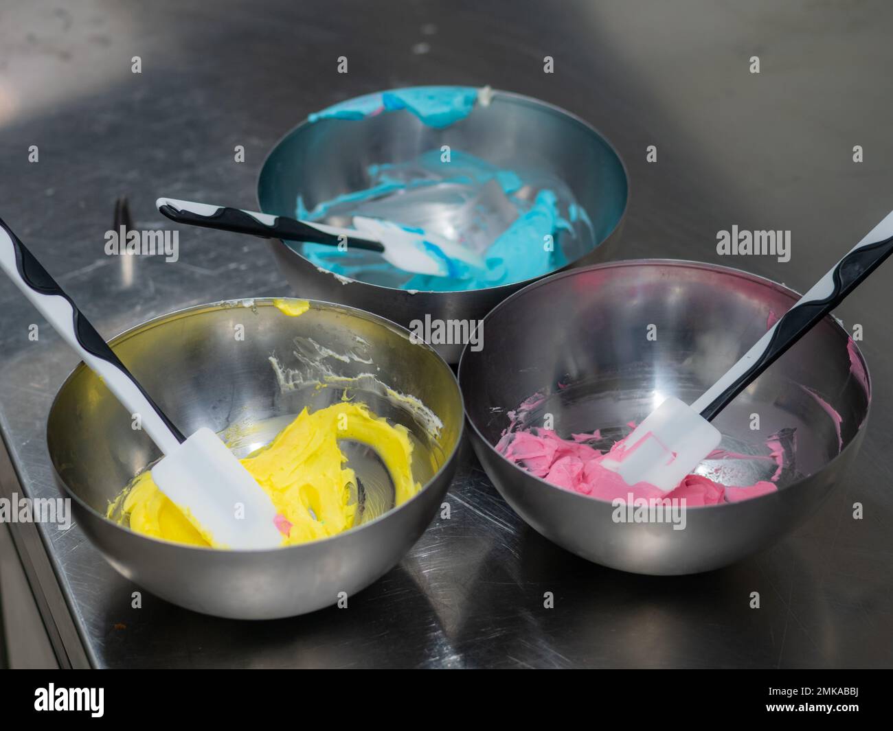 pink icing piping filling for frosted cake decoration in kitchen lab ...