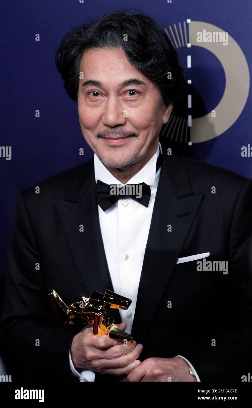Japanese actor Koji Yakusho poses after winning the Excellence in Asian ...