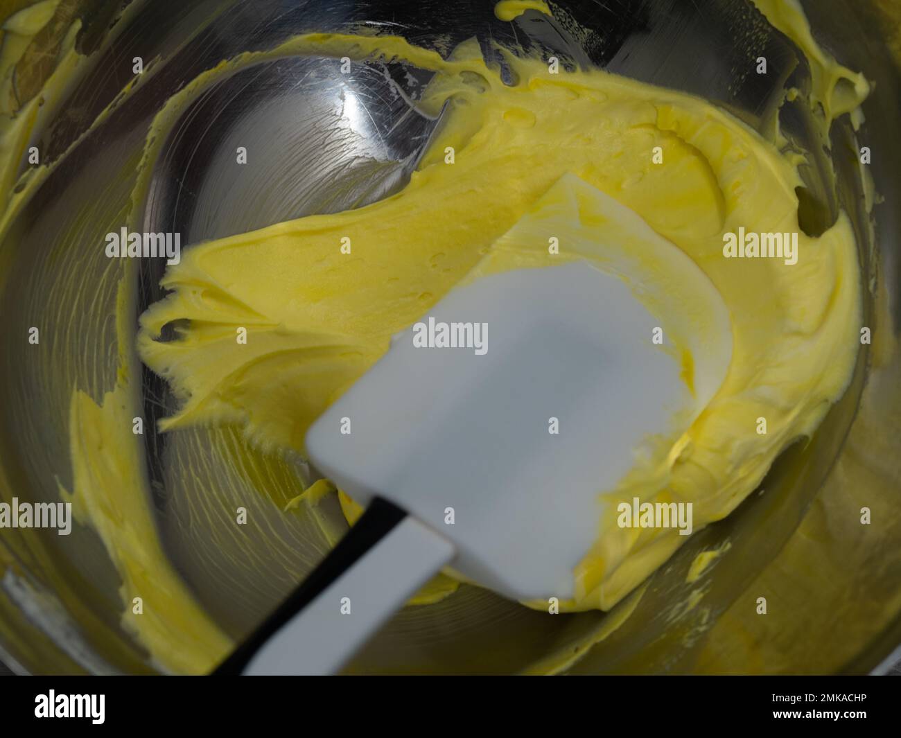 yellow icing piping filling for frosted cake decoration in kitchen lab ...