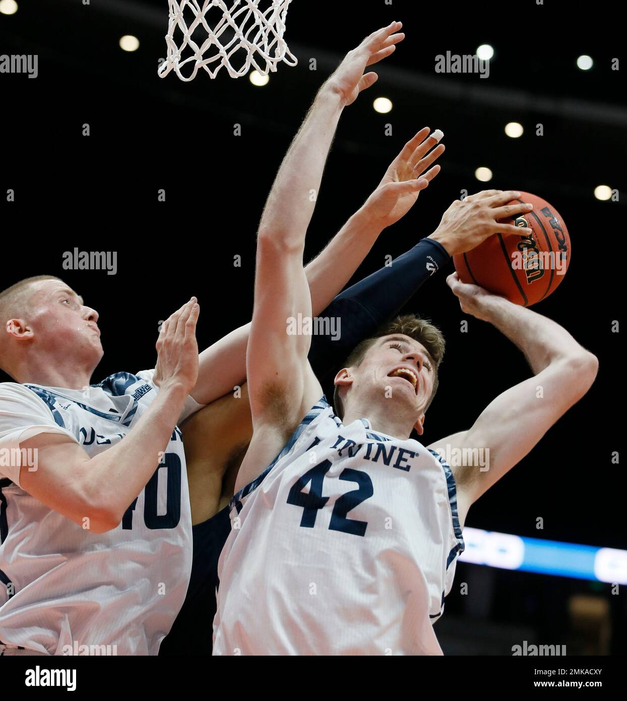 UC Irvine forward Collin Welp, left, and forward Tommy Rutherford ...