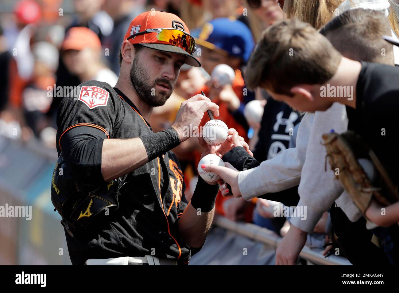 San Francisco Giants' Steven Duggar signs autographs before a spring ...