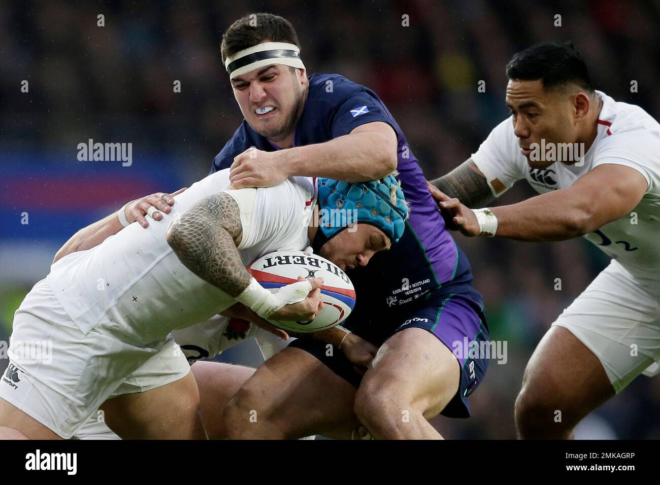 Englands Jack Nowell Left Is Tackled By Scotlands Stuart Mcinally
