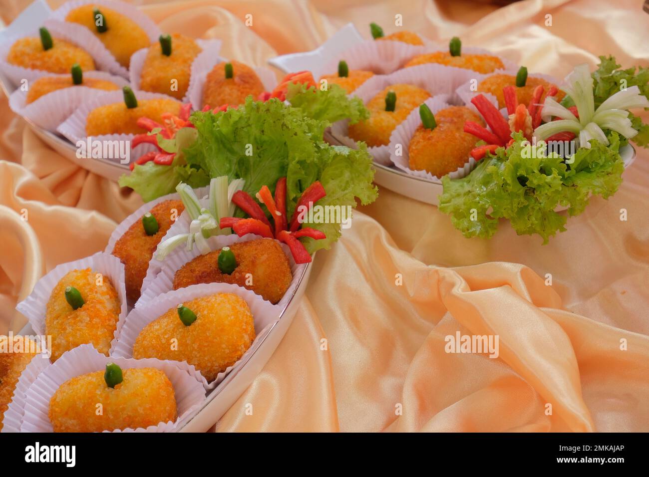Kroket kentang is a traditional snack from Indonesia. served in wooden ...