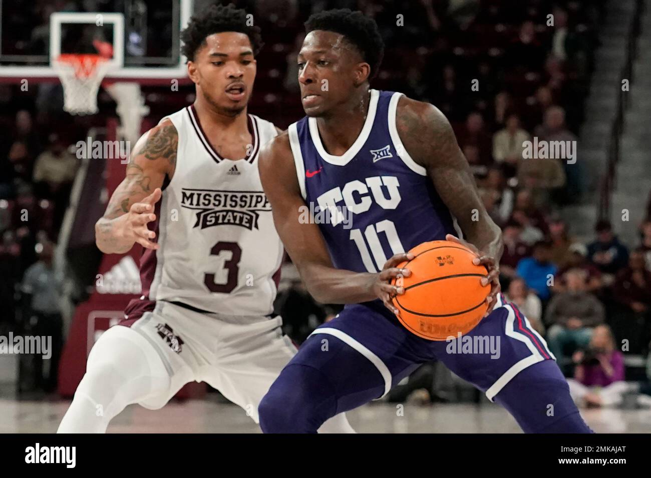 TCU guard Damion Baugh (10) is pressured by Mississippi State guard ...