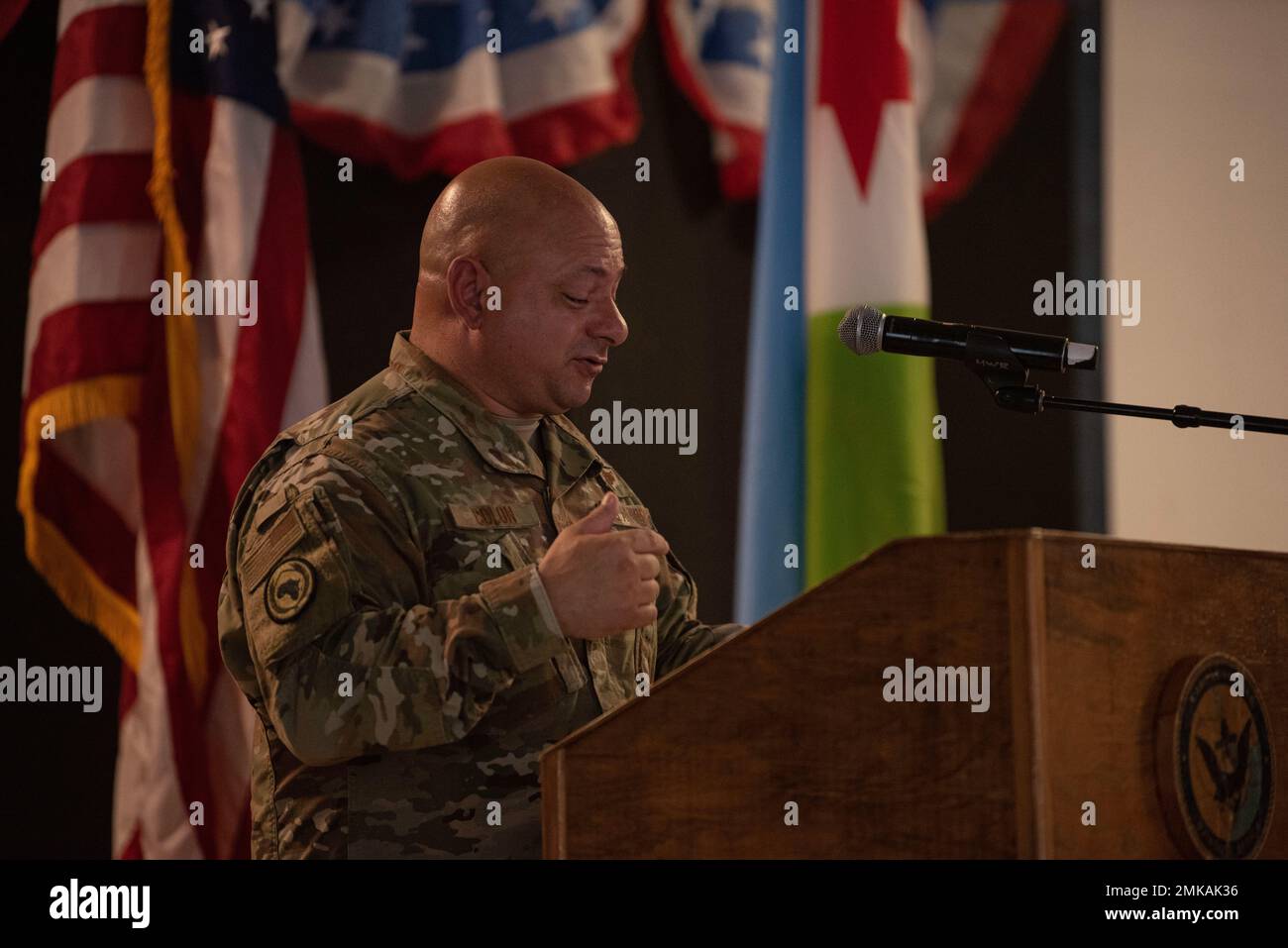 U.S. Air Force Chief Master Sgt. Jason Colon gives a farewell speech during a change of ...