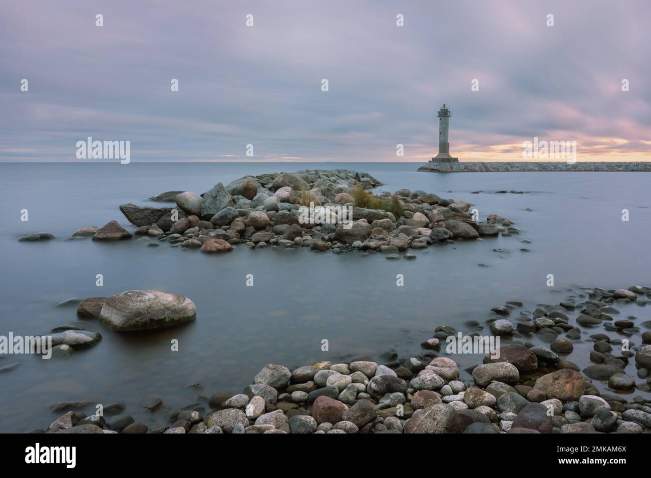 The old lighthouse in the Baltic Sea at dawn photographed on long ...