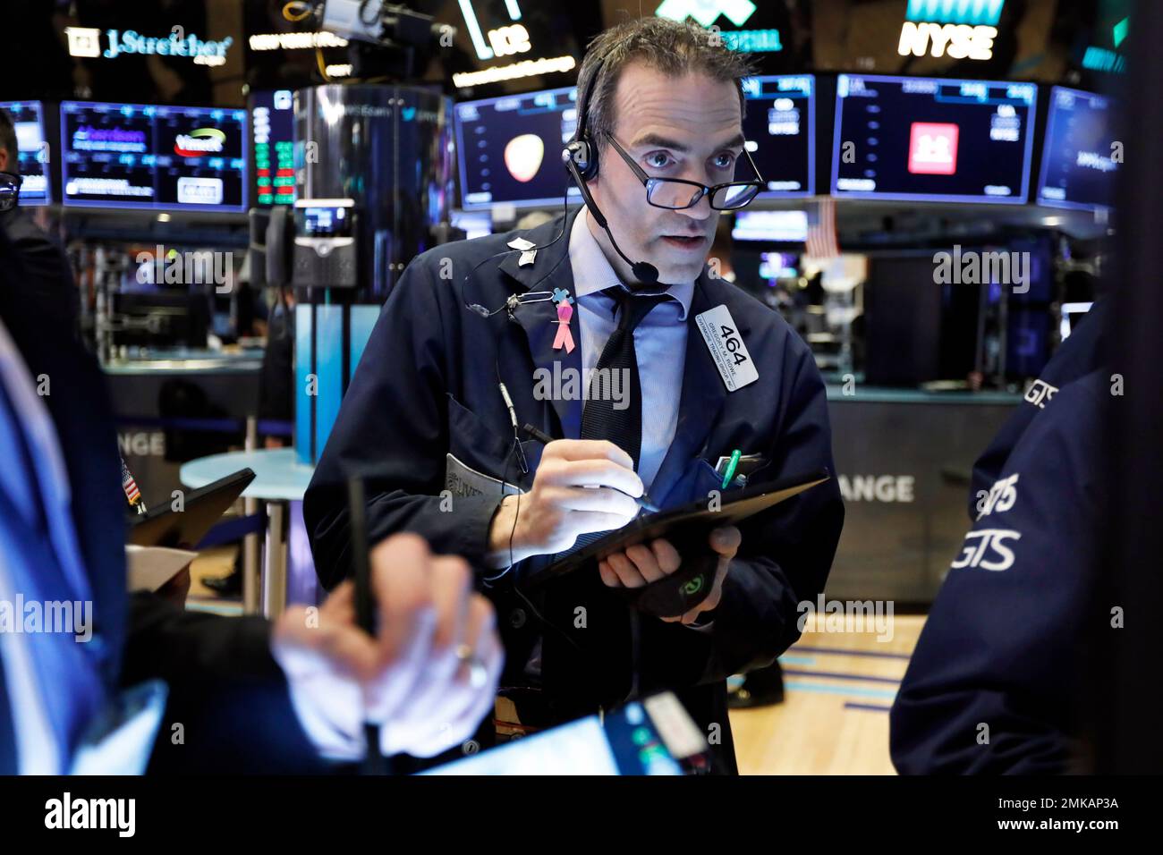 FILE- In this March 5, 2019, file photo trader Gregory Rowe works on the floor of the New York ...