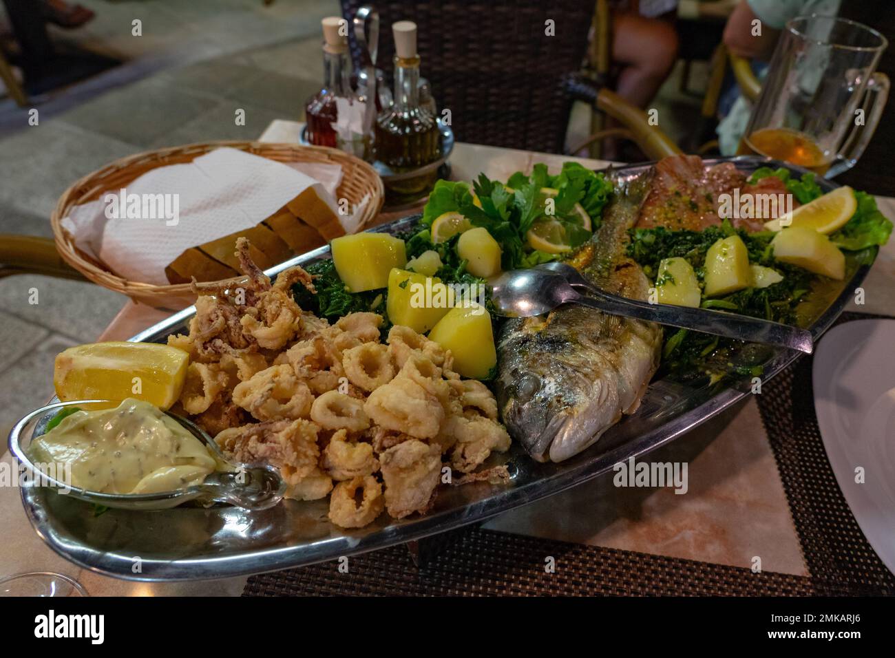 seafood fish platter in Croatia with tuna fish Calamari and spinat ...