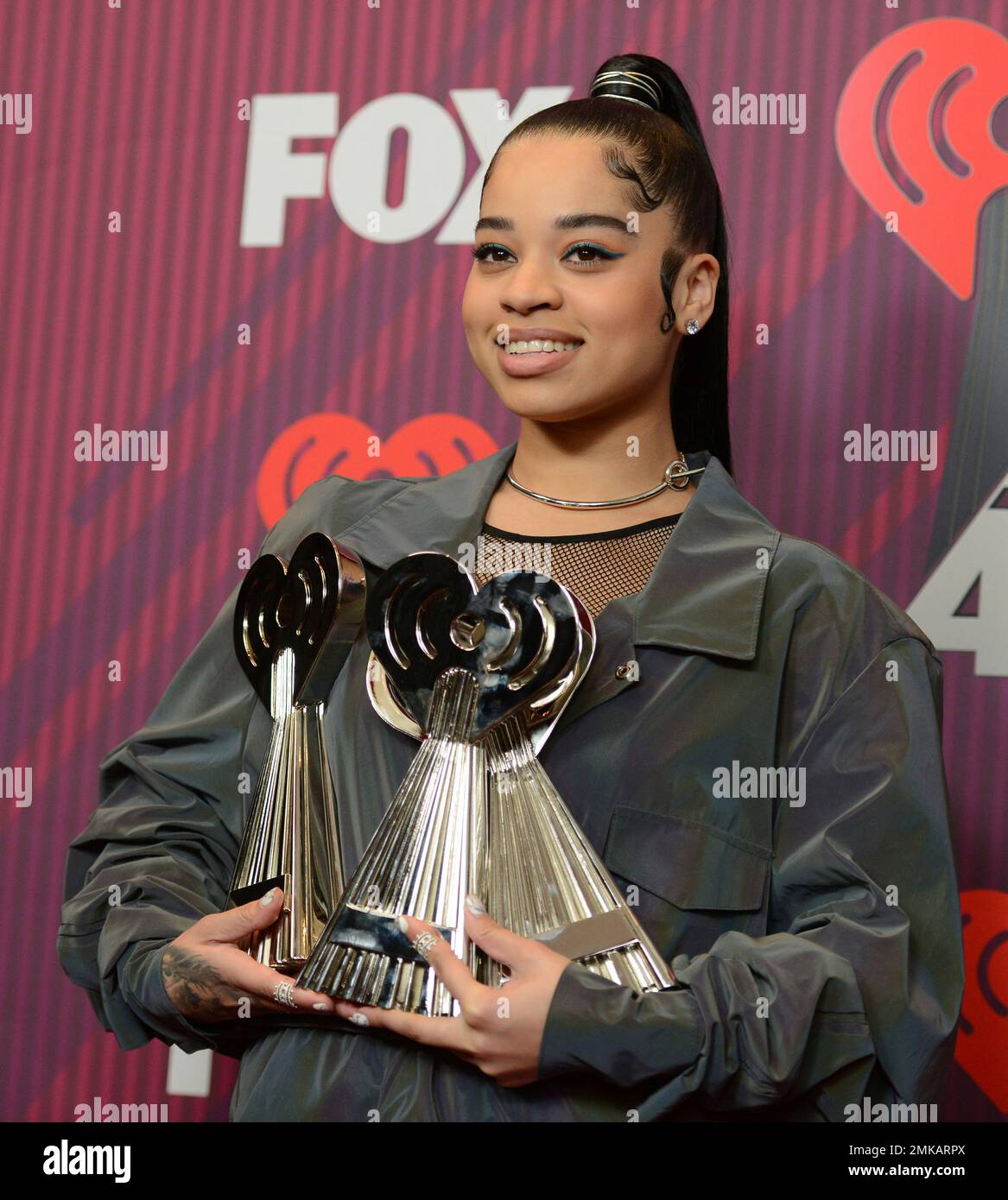 Ella Mai poses in the press room with the awards for R&B song of the ...