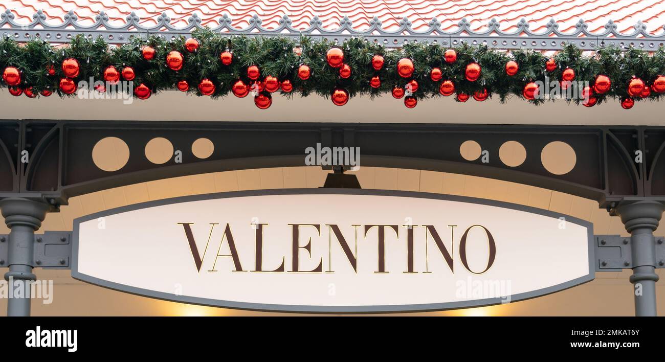Vienna, Austria - December 10, 2022: Valentino store sign with gold ...