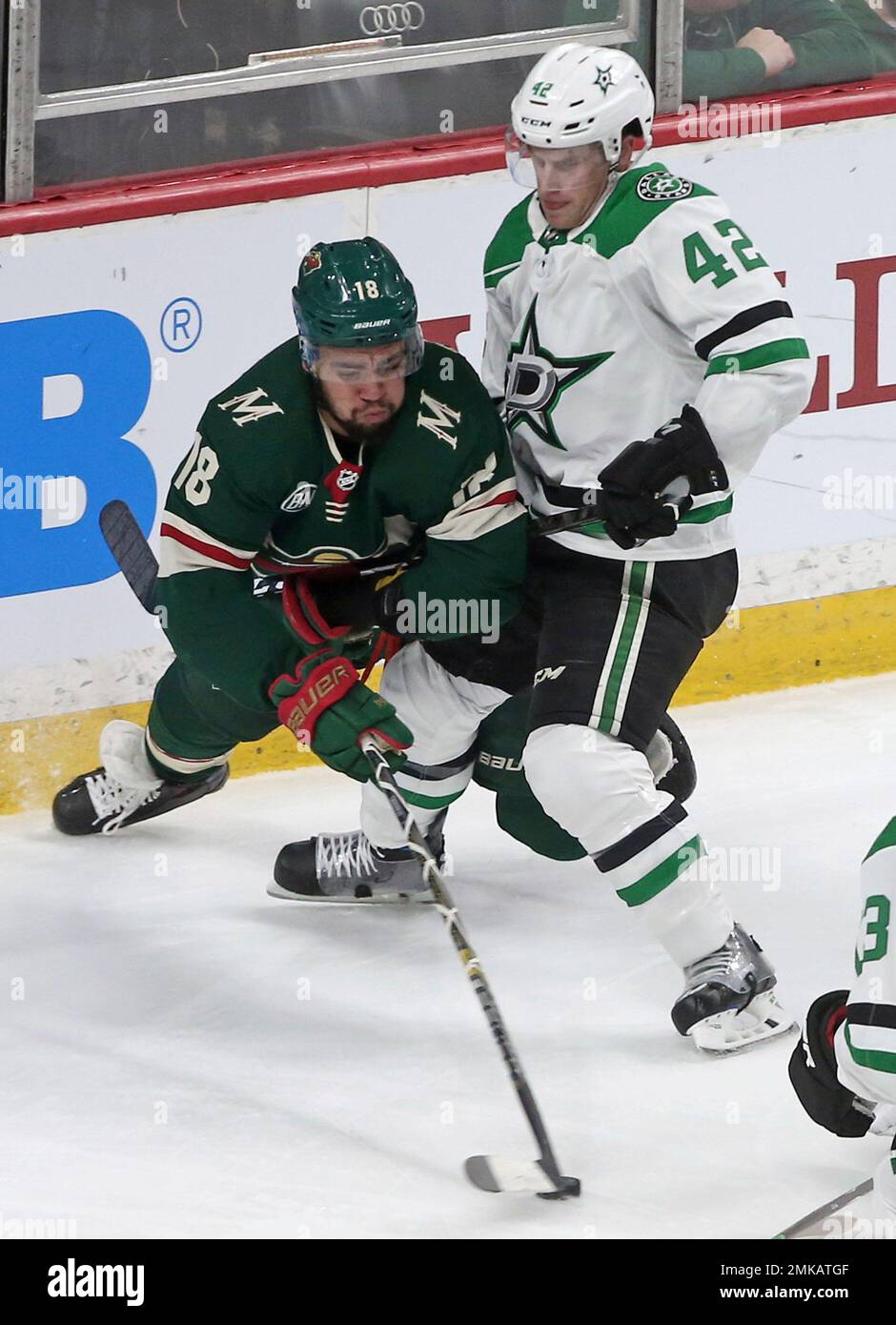 Minnesota Wild's Jordan Greenway, left, tries to get around Dallas ...