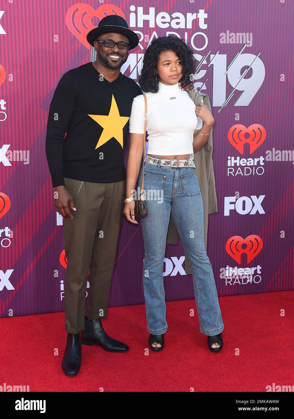 Wayne Brady, left, and his daughter Maile Masako Brady arrive at the ...
