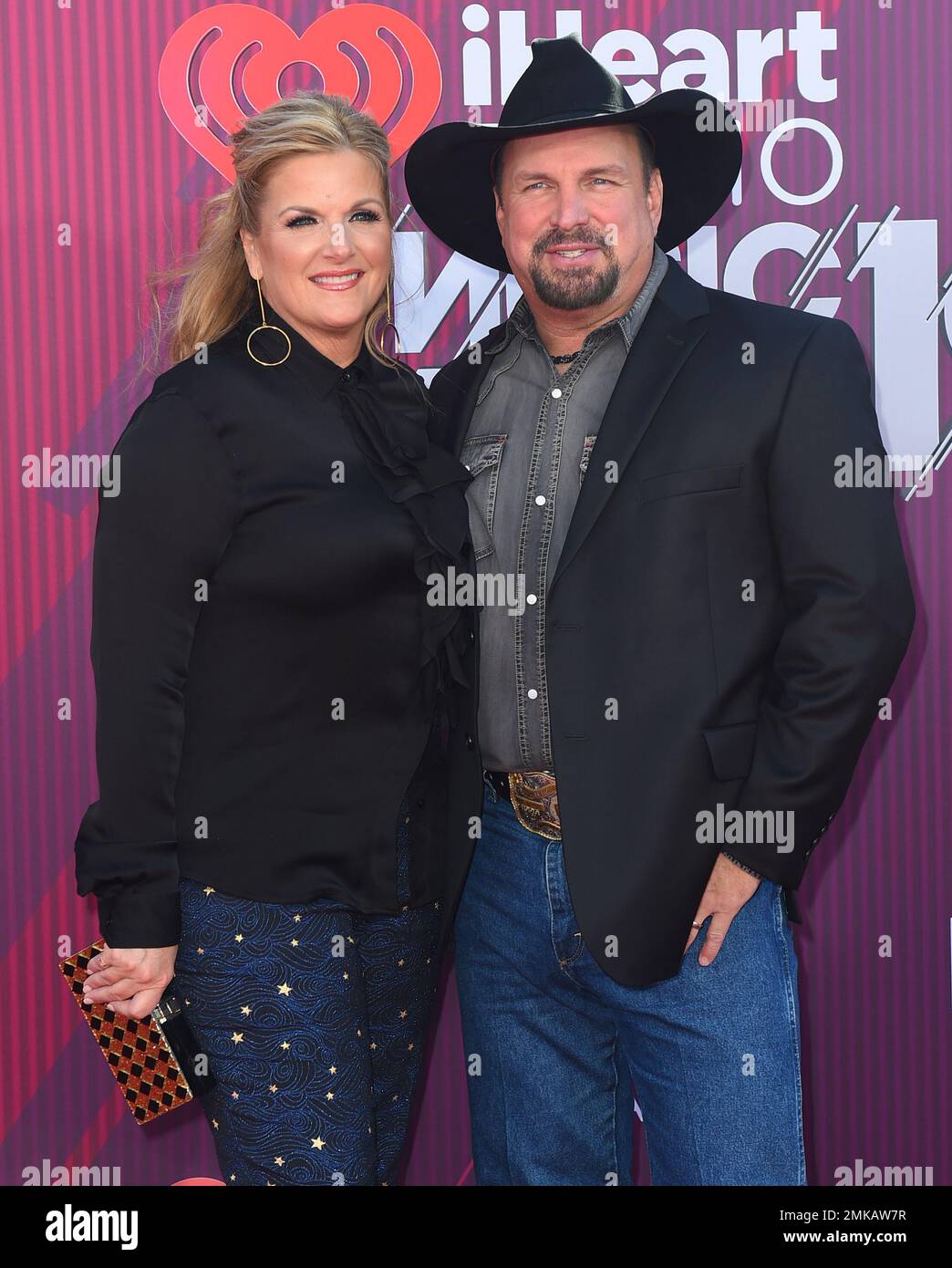 Garth Brooks, right, and Trisha Yearwood arrive at the iHeartRadio ...