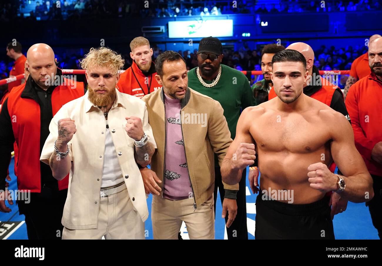 Jake Paul and Tommy Fury pose after a face-off in the ring at the OVO ...