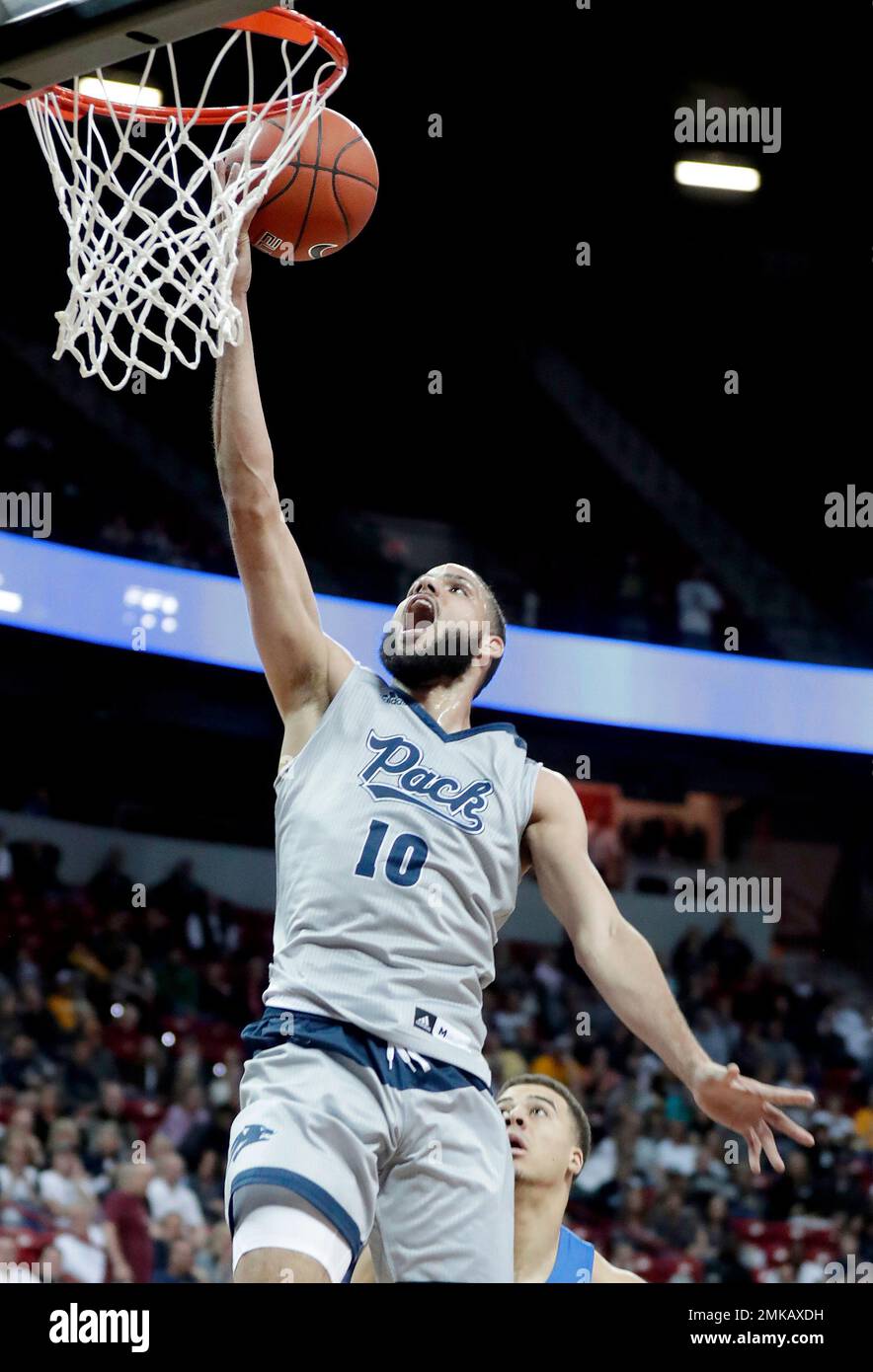Nevada's Caleb Martin shoots during the first half of an NCAA college ...