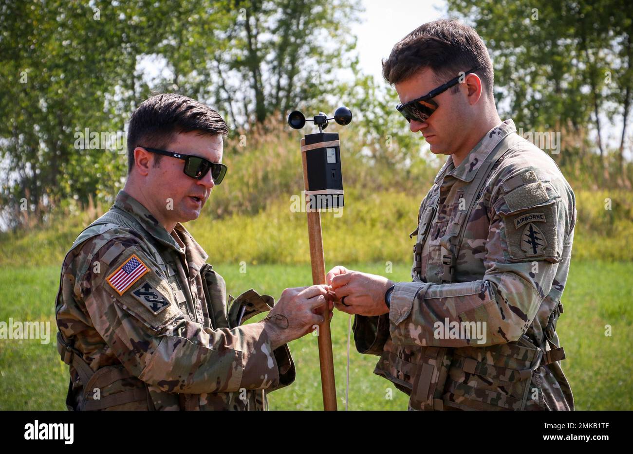 U.S. Army Soldiers set up an anemometer during an air drop and sling ...
