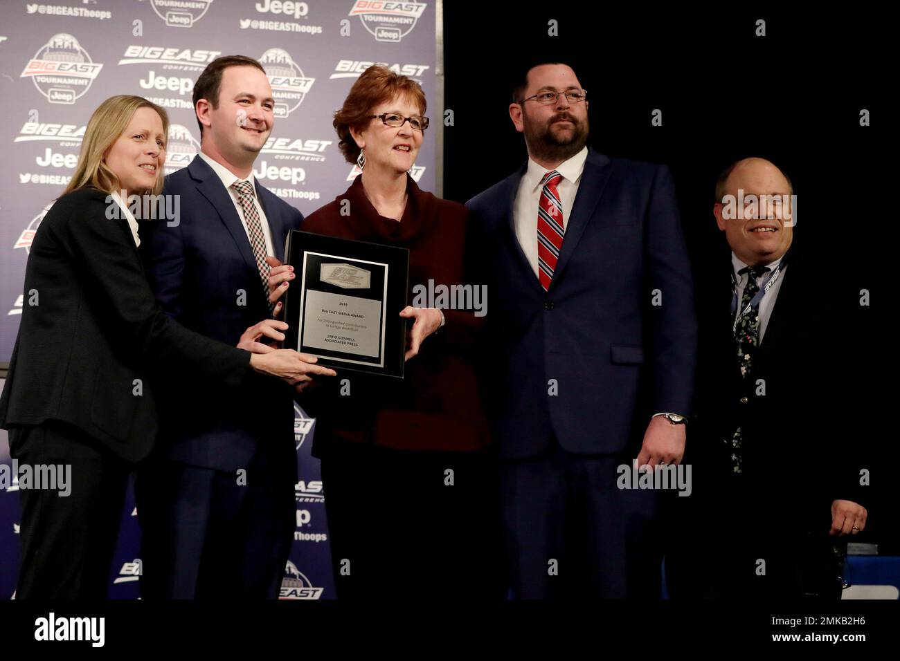 Anne O'Connell, center, widow of former Associated Press college ...