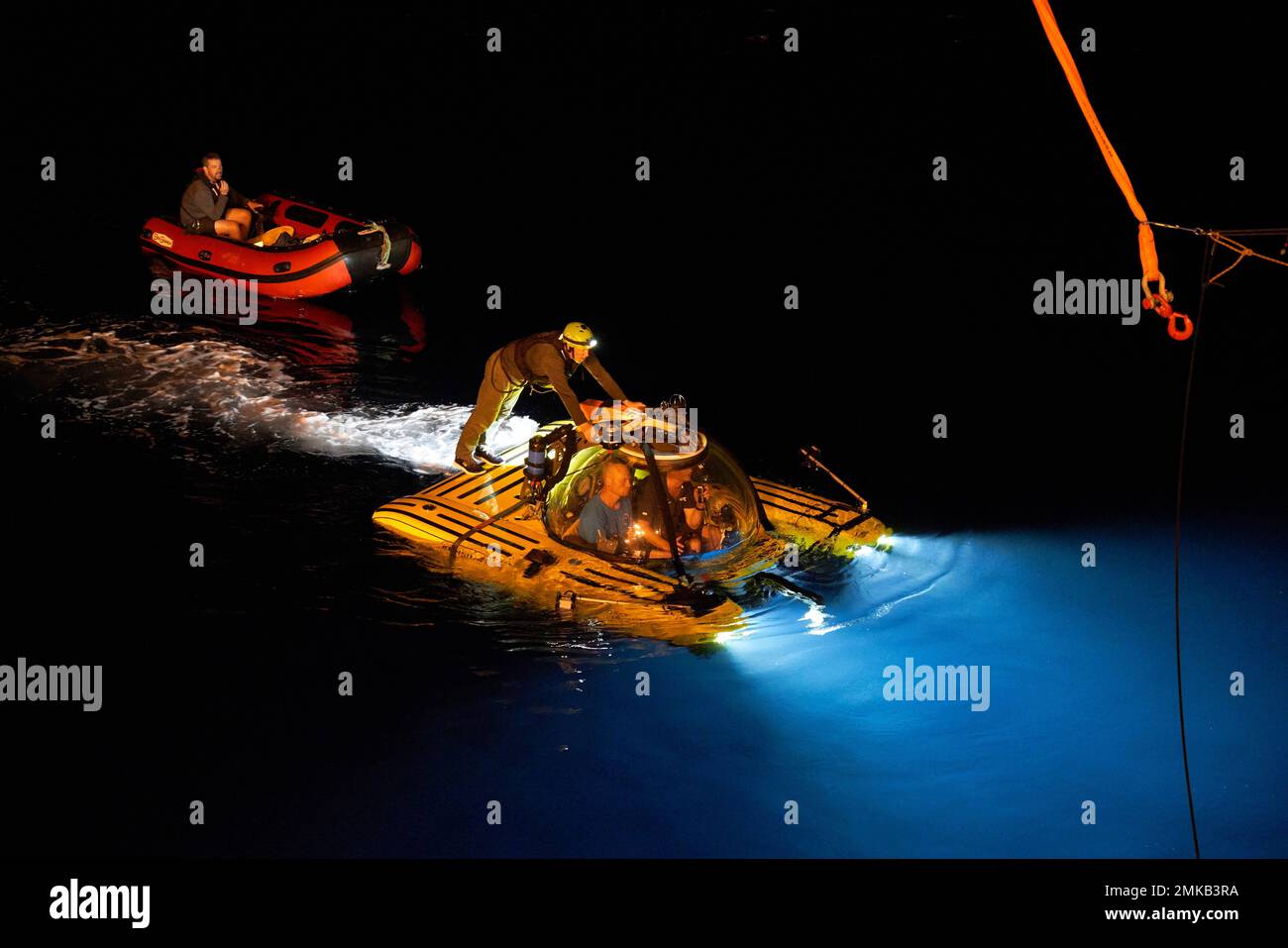 The manned submersible surfaces after dark after a failed mission to ...