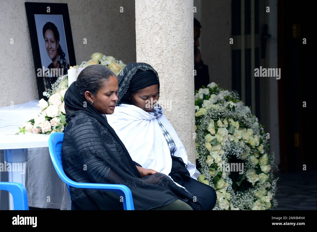 Family members mourn for crash victim air hostess Sara Gebremichael, 38 ...