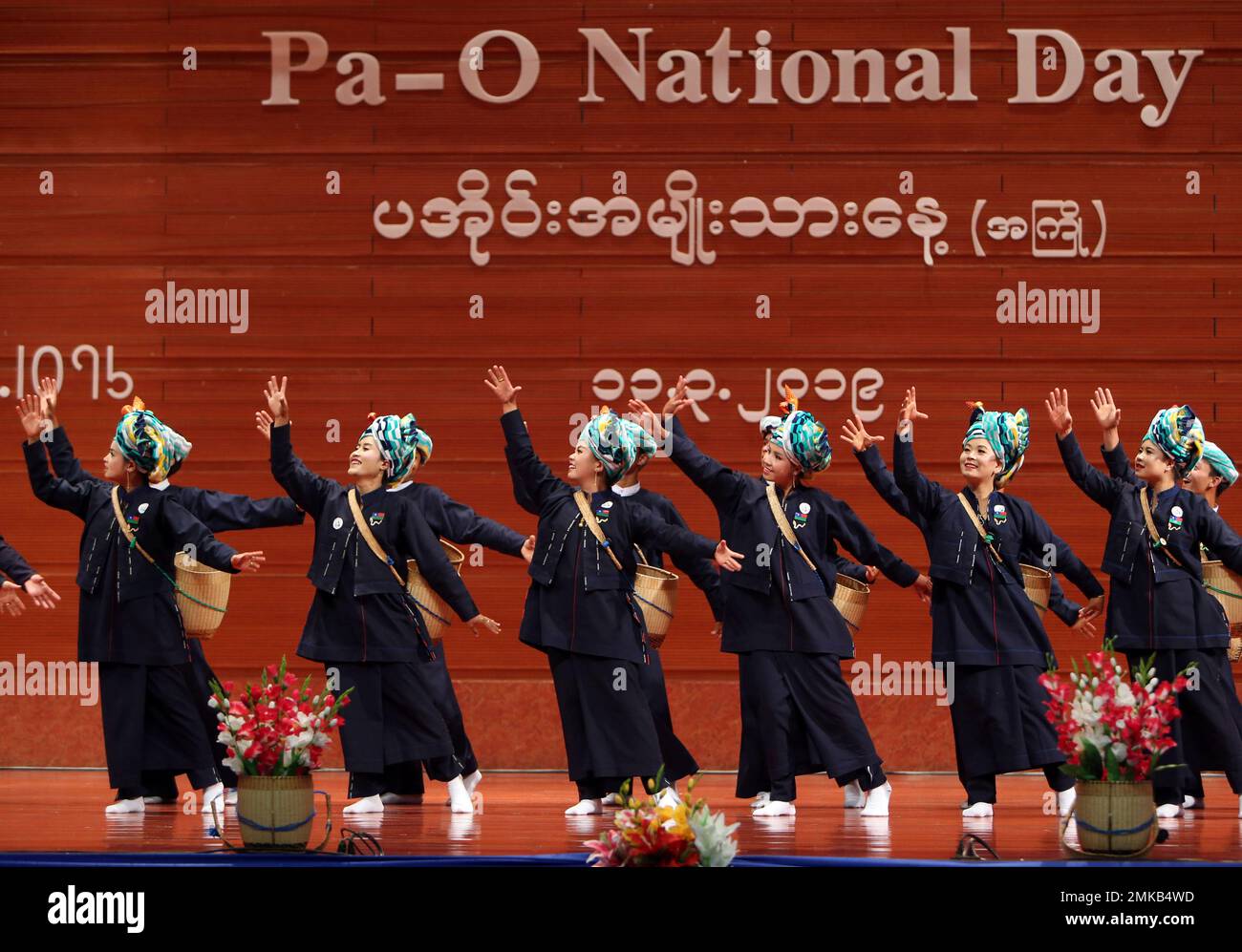 Members of the Pa-O tribe's artist troupe perform a traditional dance ...