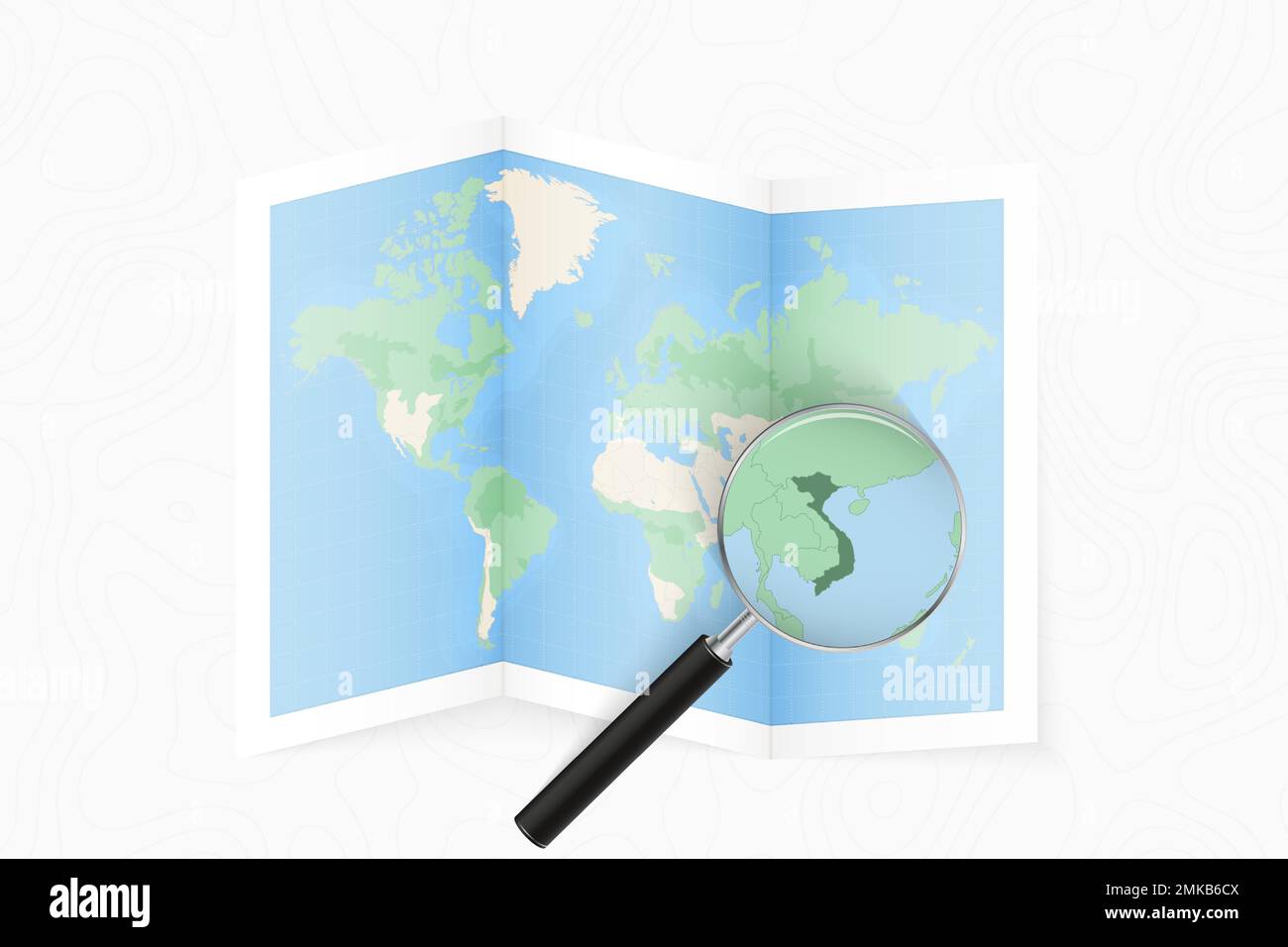 Enlarge Vietnam with a magnifying glass on a folded map of the world ...