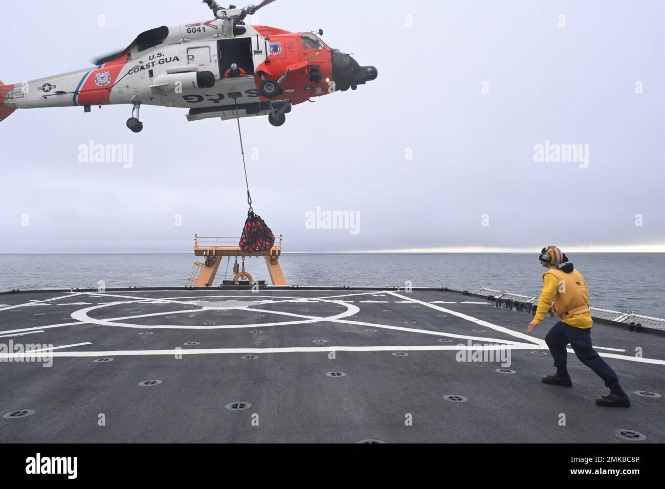 An Air Station Kodiak MH-60 Jayhawk helicopter aircrew takes off during ...