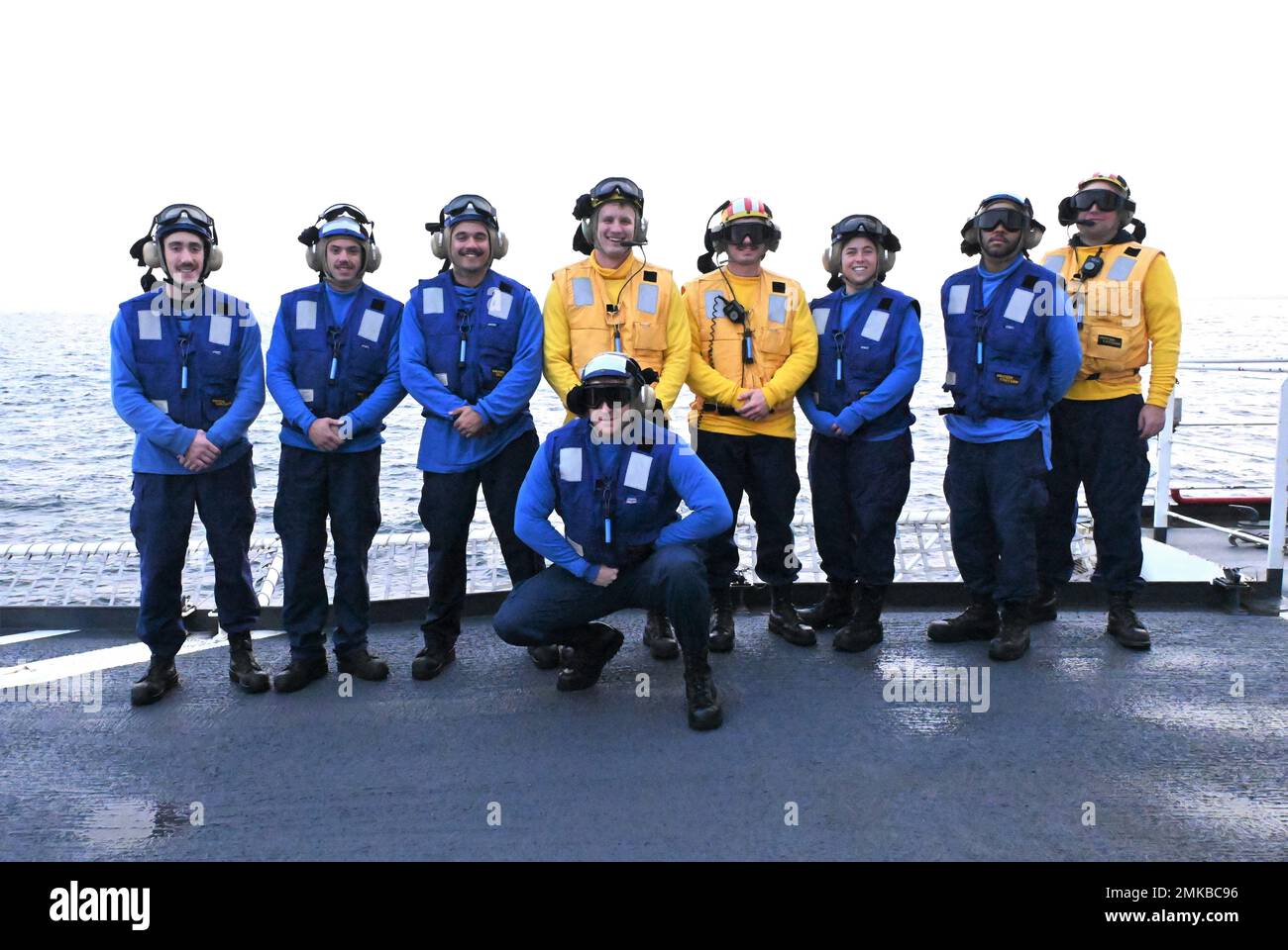Flight deck crew members pose for a photo before flight operations ...