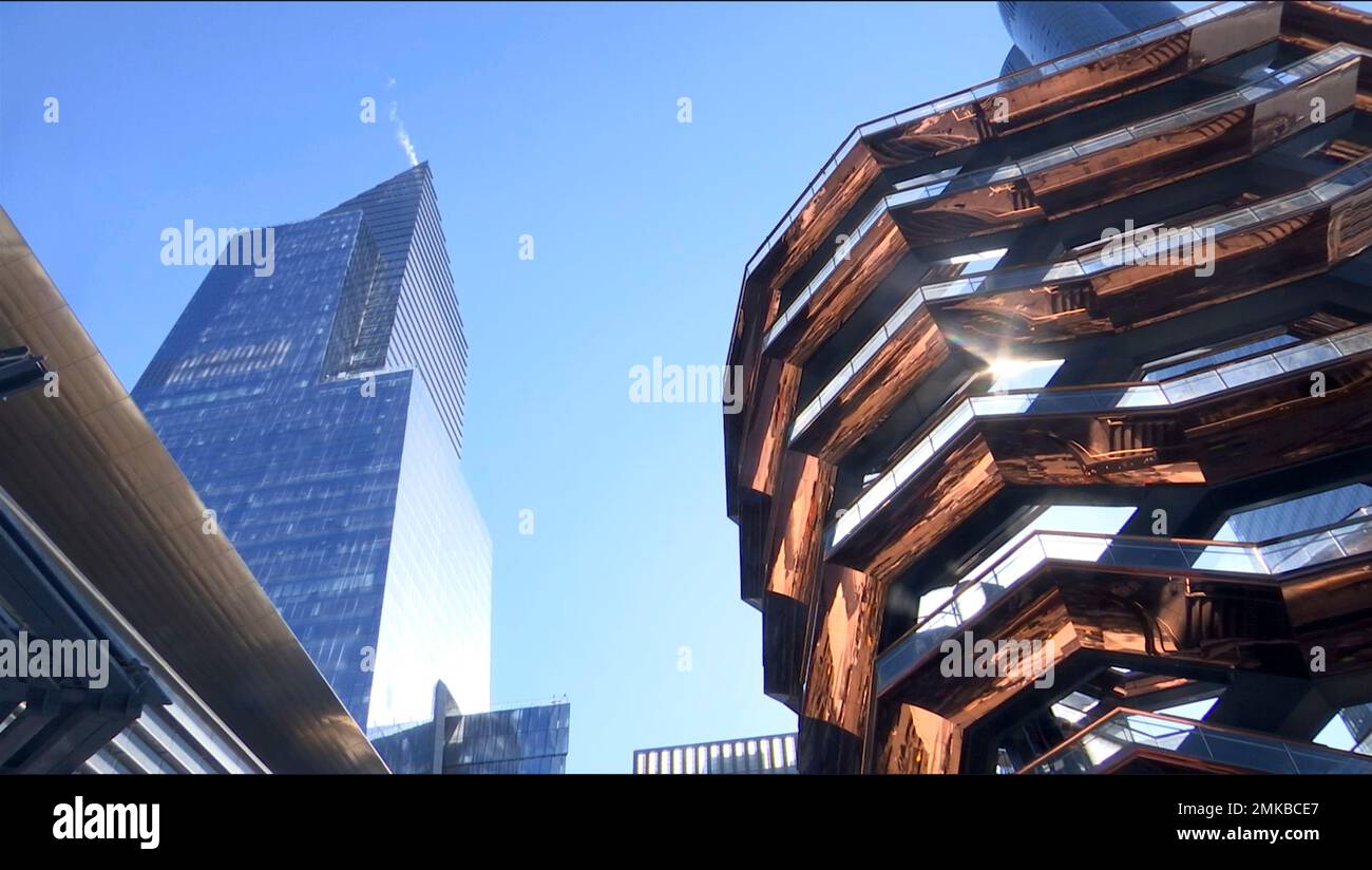 The sun glistens off Vessel, a 150 foot tall structure of climbable ...