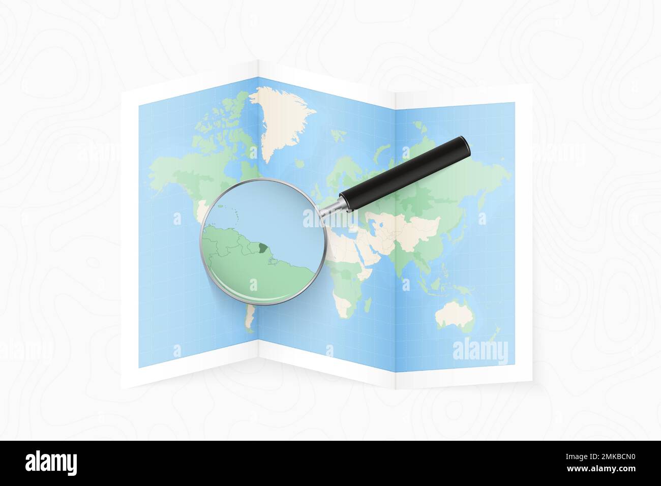 Enlarge French Guiana with a magnifying glass on a folded map of the ...