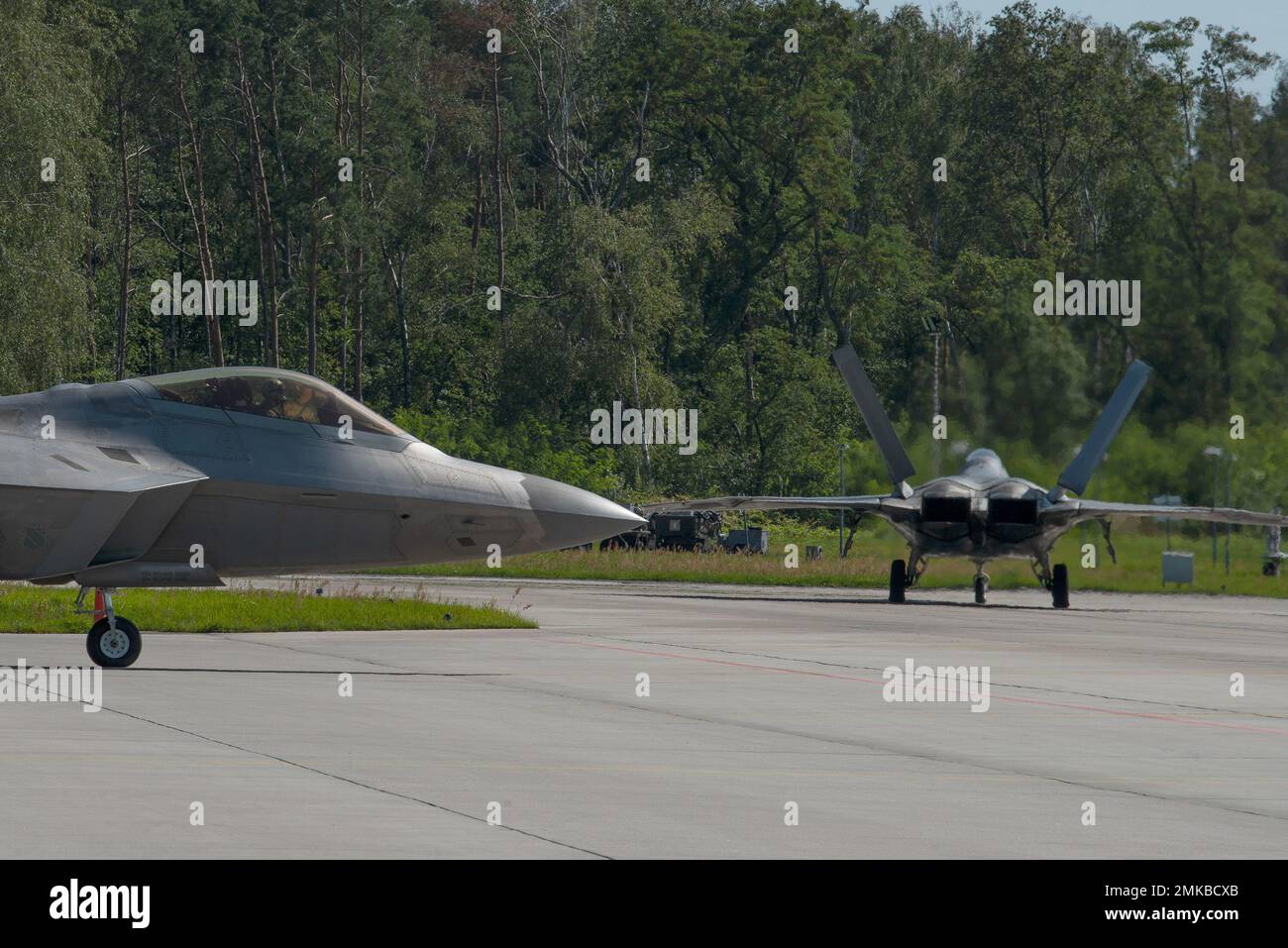 U.S. Air Force F-22 Raptors assigned to the 90th Expeditionary Fighter ...