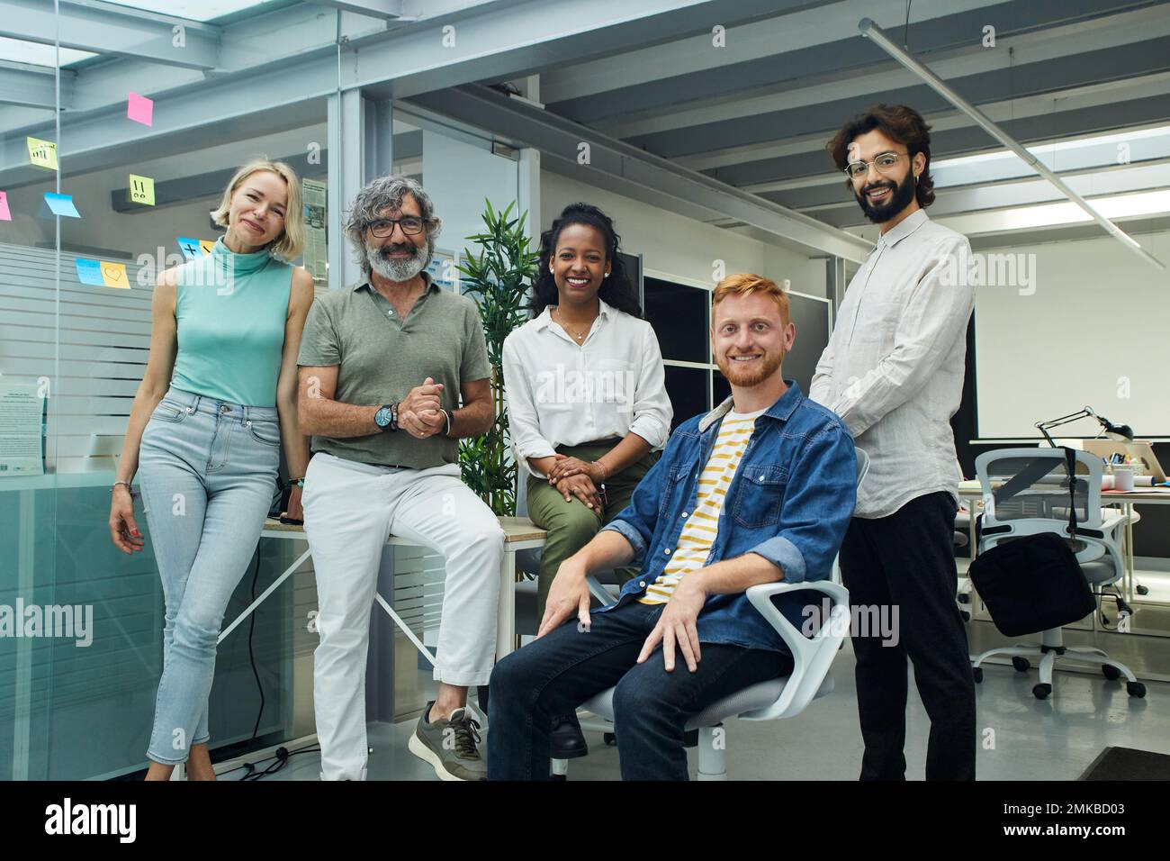 Successful group of business people at the office looking at the camera smiling hi-res stock ...