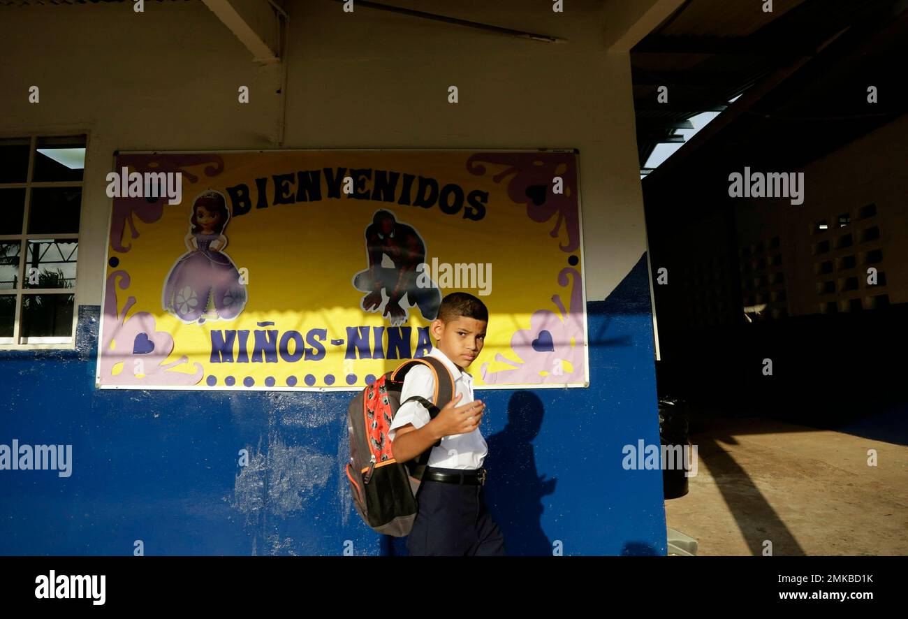 A student walks to his classroom on the first day of school of the year ...