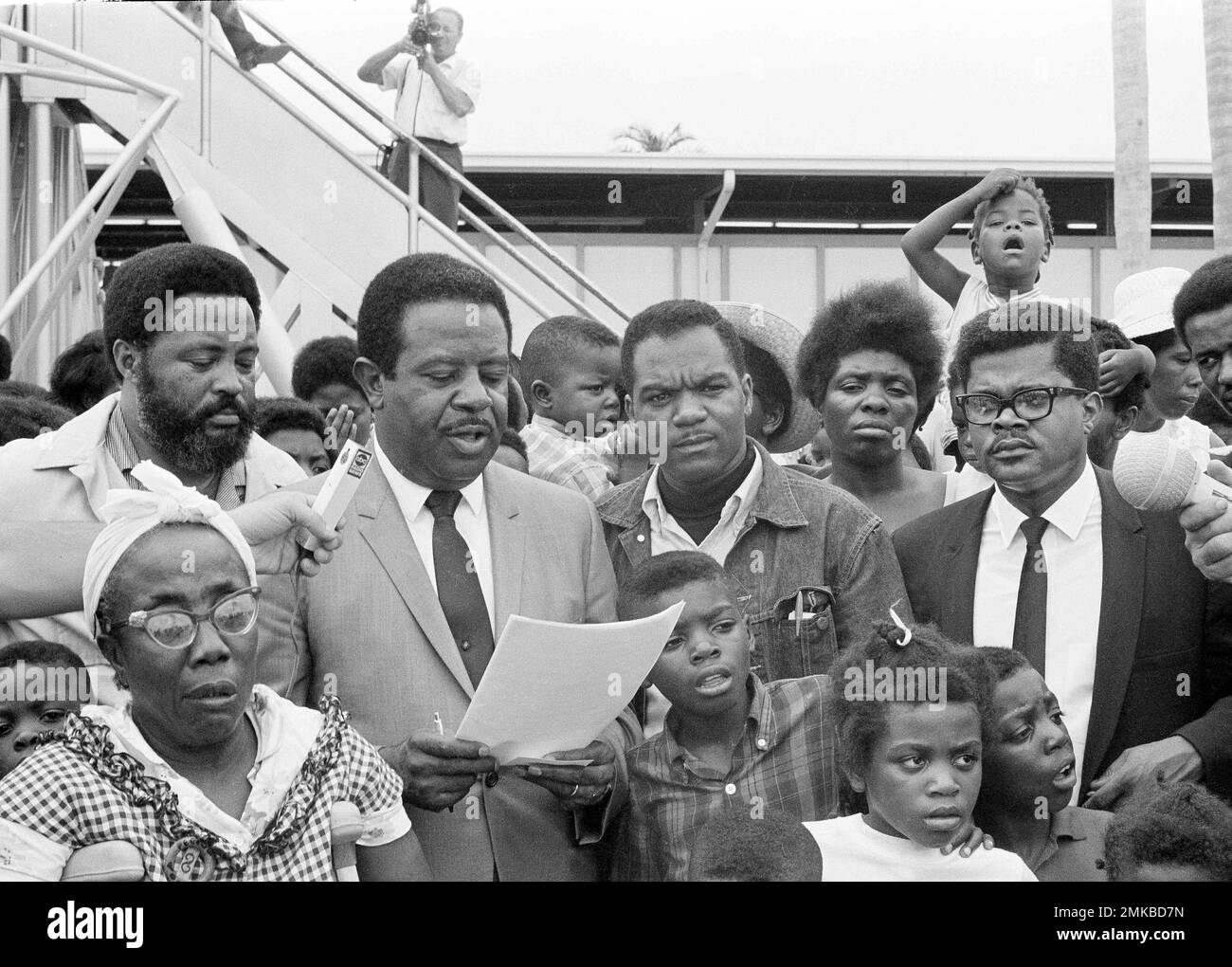 A small group of demonstrators, led by Hosea Williams, center with ...