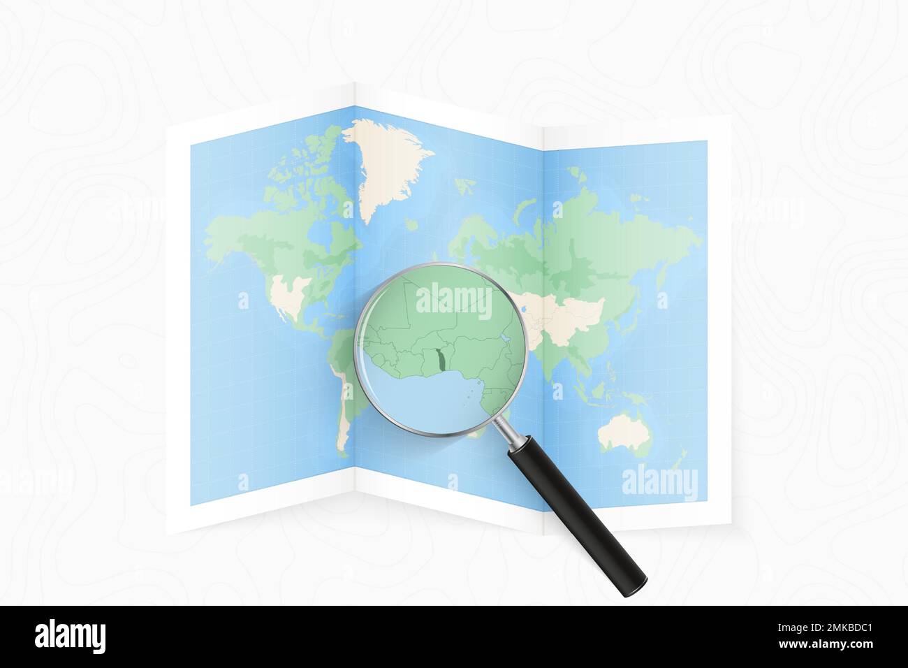 Enlarge Togo with a magnifying glass on a folded map of the world ...
