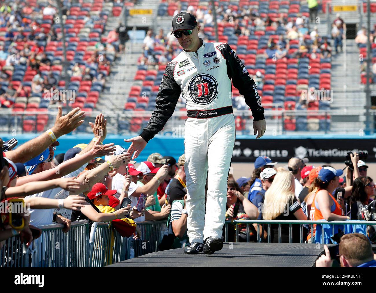 Kevin Harvick is greeted by fans during driver introductions prior to ...