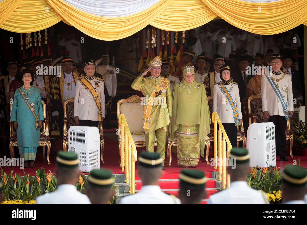 Malaysia's King Sultan Abdullah Sultan Ahmad Shah, center left, salutes ...
