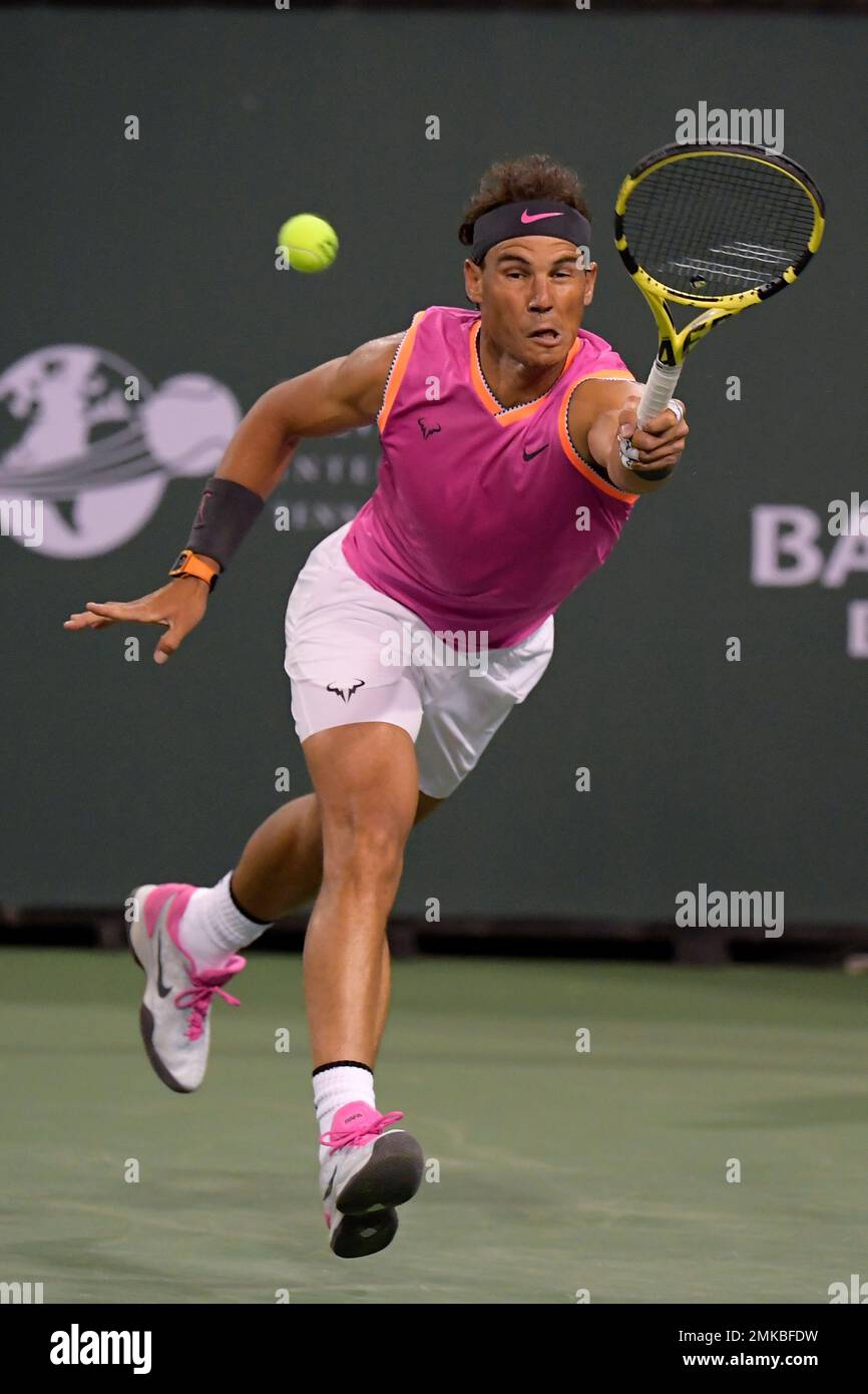 Rafael Nadal, of Spain, returns a shot to Jared Donaldson at the BNP ...