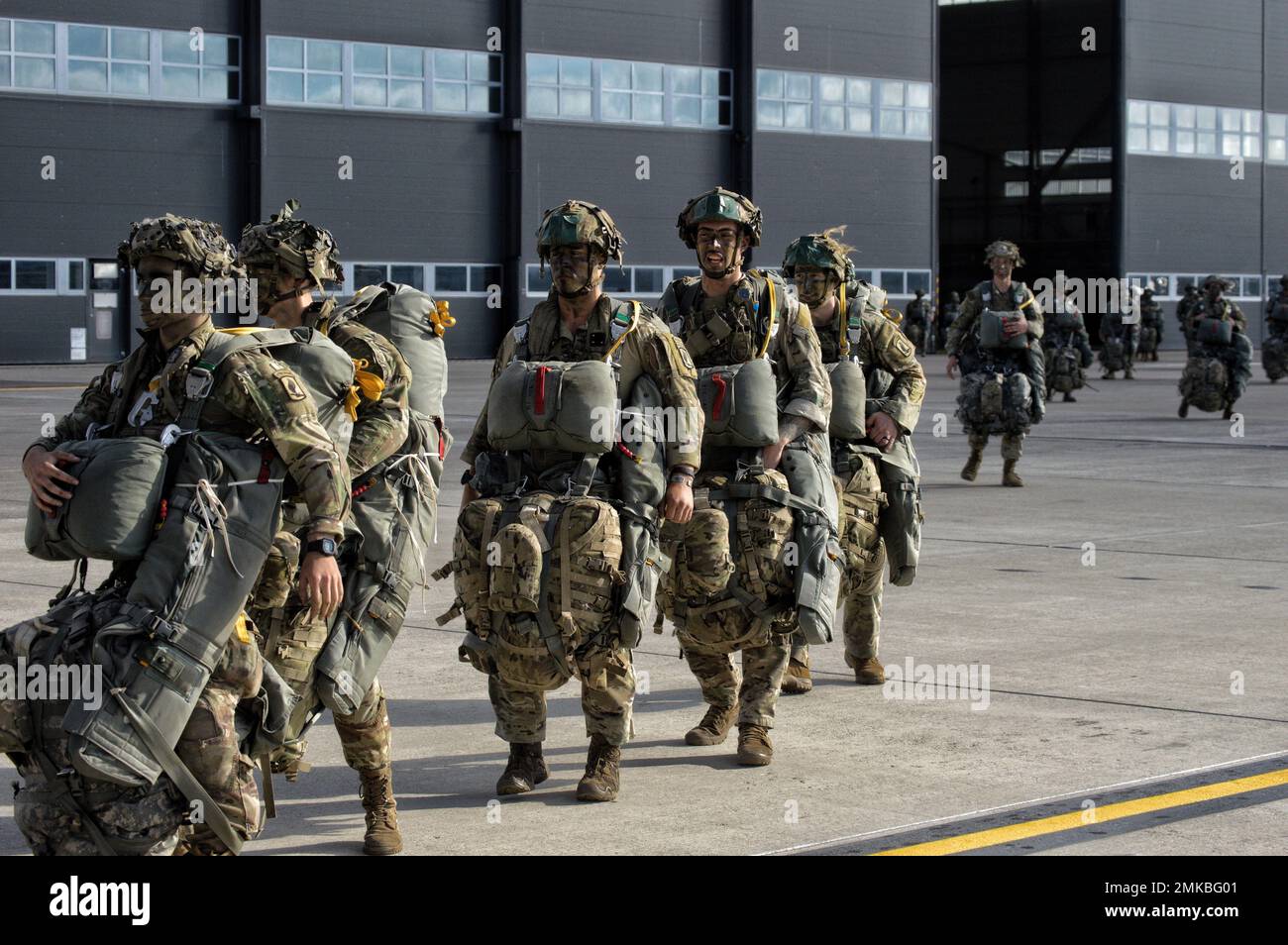 U.S. Army soldiers assigned to the 173rd Airborne Brigade walk in a ...