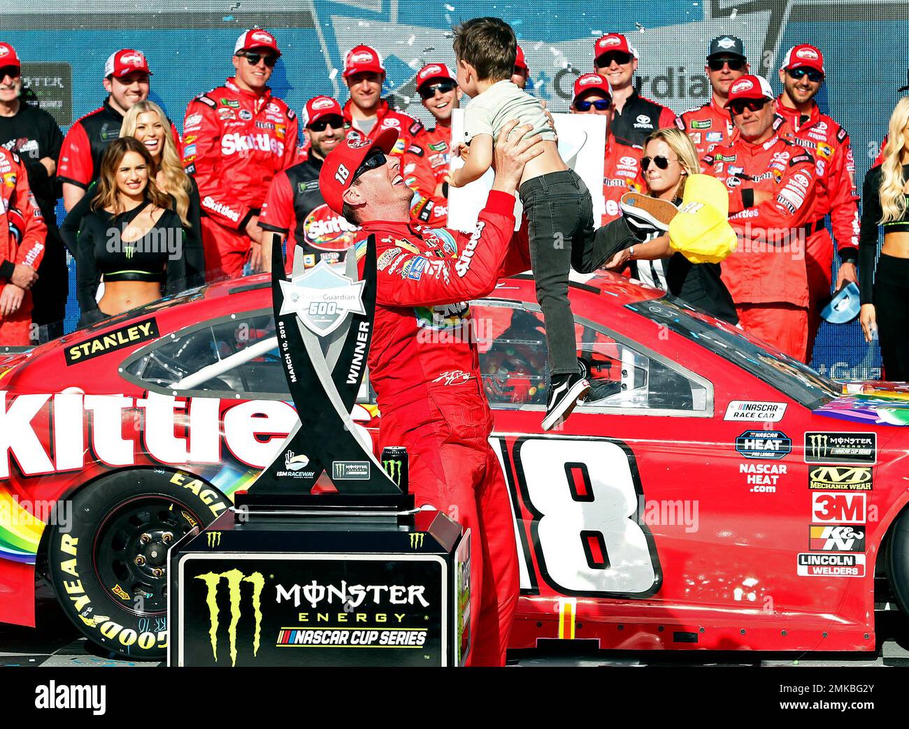 Kyle Busch tosses his son Brexton in the air after winning the NASCAR ...