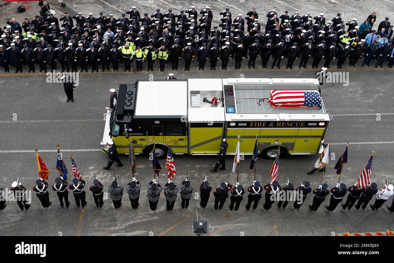 The casket of Berwick Fire Capt. Joel Barnes is carried atop a fire ...
