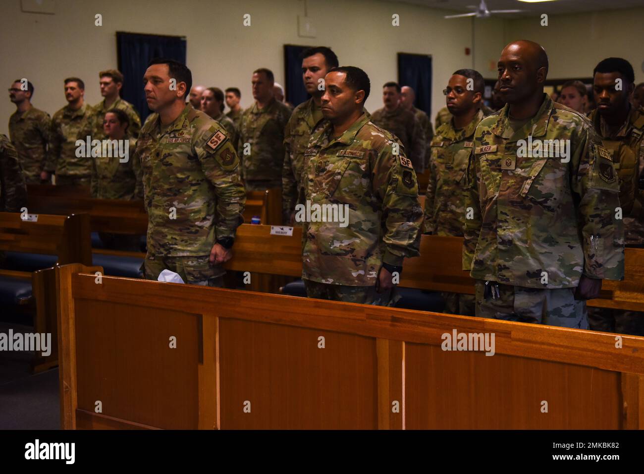 Members from the 8th Security Forces squadron stand at attention during ...
