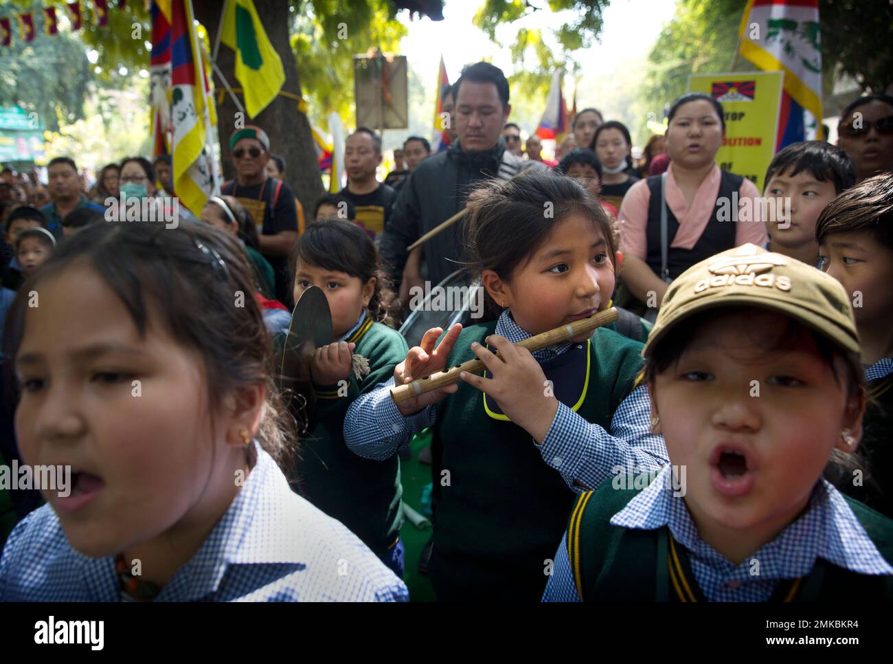 Tibetan school children sing their national anthem at the end of a ...